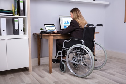 Disabled Businesswoman Working On Computer - Compliance Standard Group